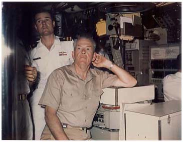 The CO (behind the periscope) explaining the torpedo approach to the ...